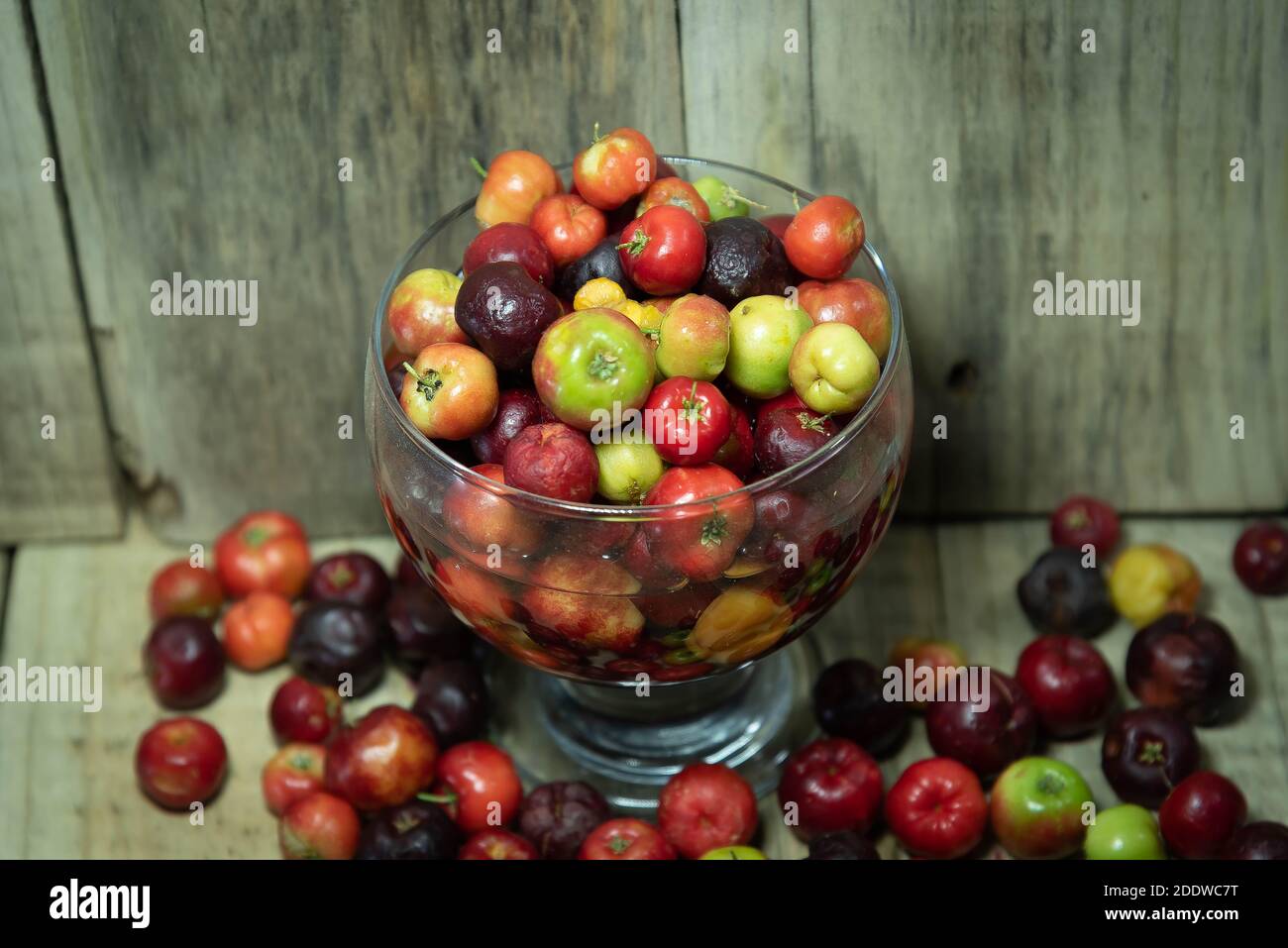 Bowl with Acerola fruits (Malpighia emarginata). Small fruit with ...