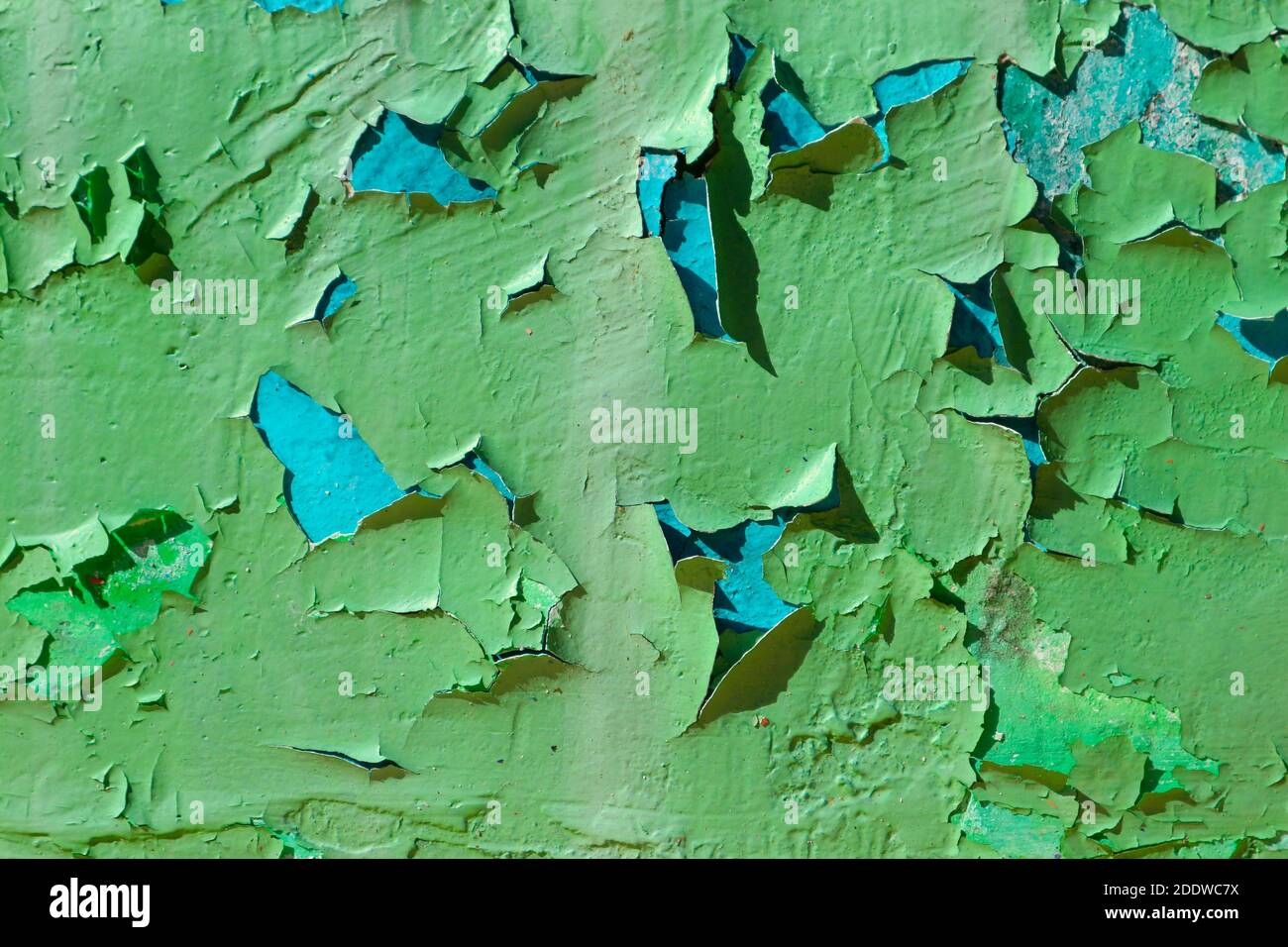 The photo of cracked and peeling paint on the old wall. Grunge texture ...