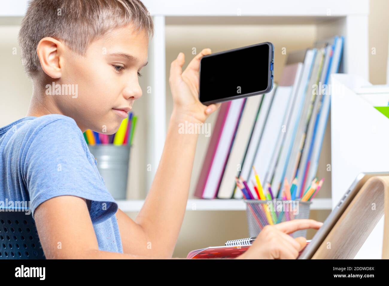 Digital distractions during online learning classes. Boy distracting ... Digital distractions during online learning classes. Boy distracting ...