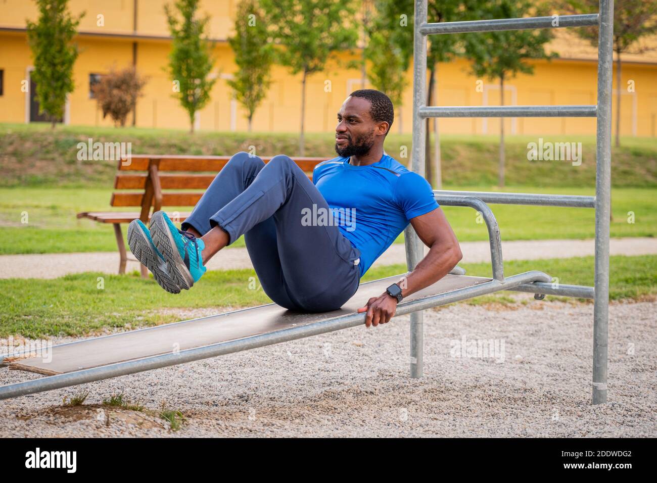 Fitness afro american boy doing situps outdoor - Handsome african man ...