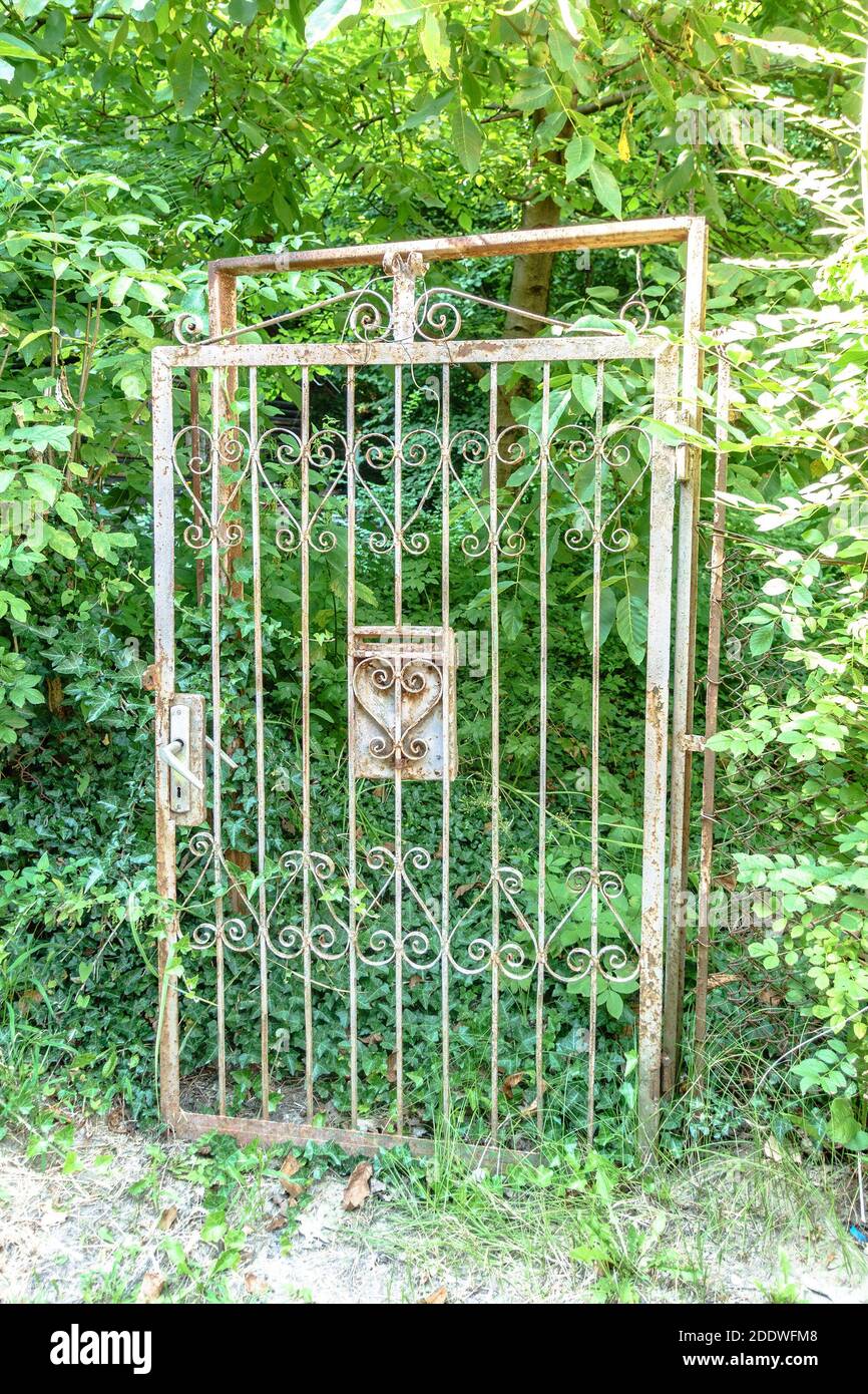 Rusty wrought iron gate hi-res stock photography and images - Alamy