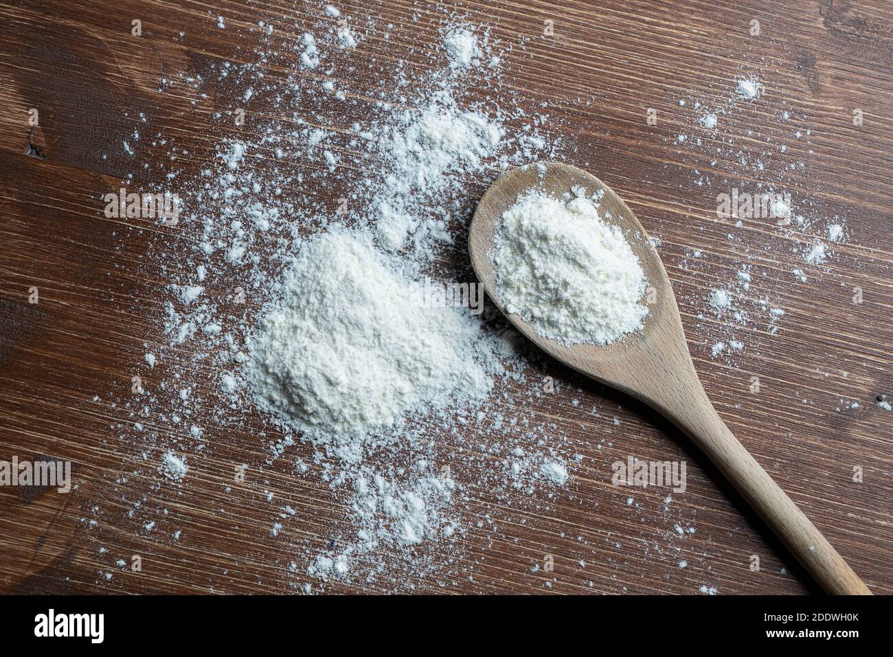 a wooden ladle with wheat flour Stock Photo - Alamy