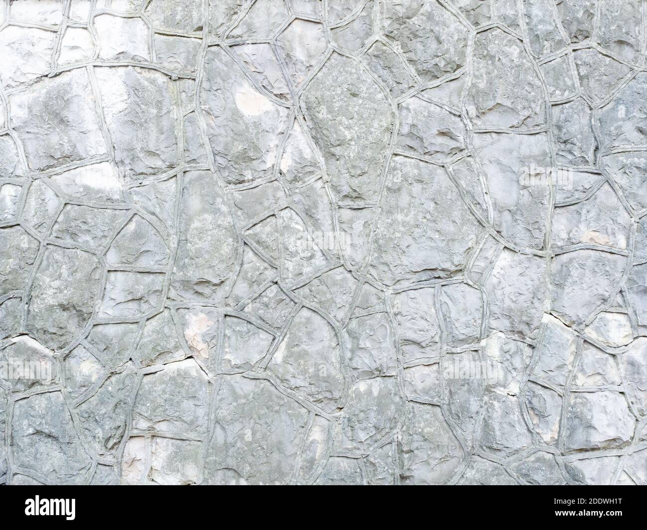Background gray textured wall with rough patterned masonry. Full screen ...