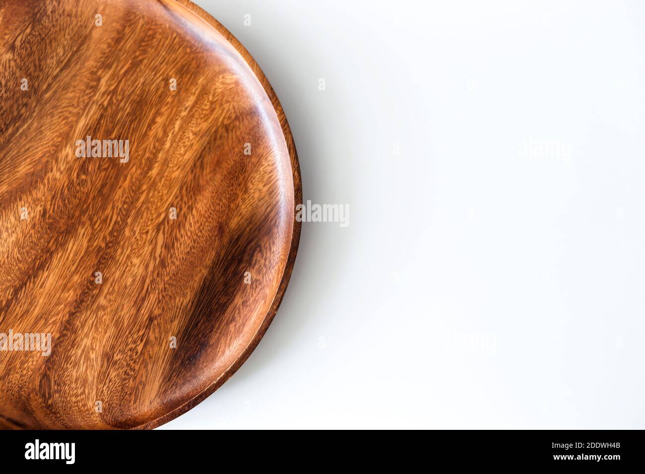 Wooden plate top view on white background Stock Photo - Alamy