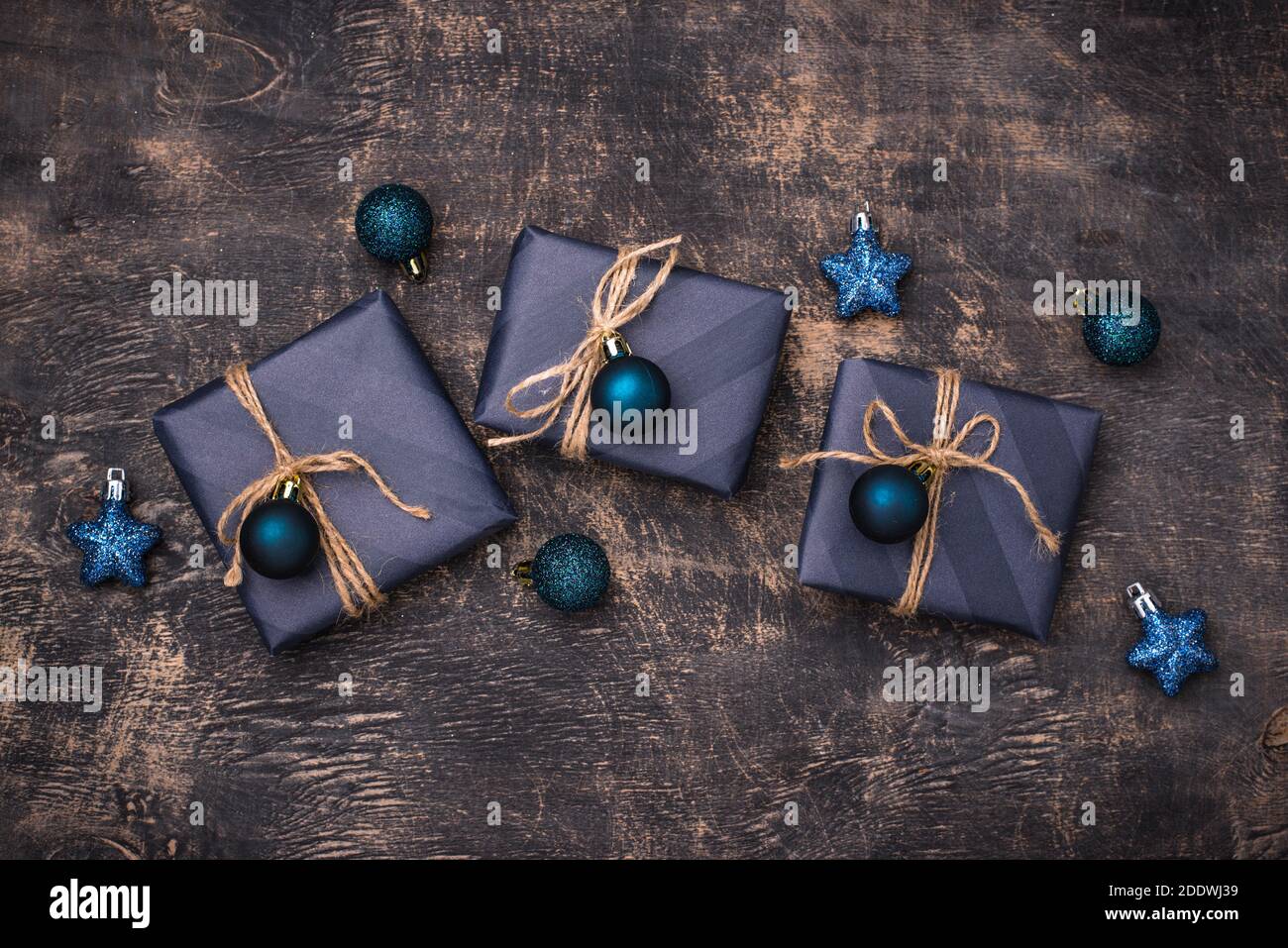 Christmas gift boxes in blue paper Stock Photo - Alamy