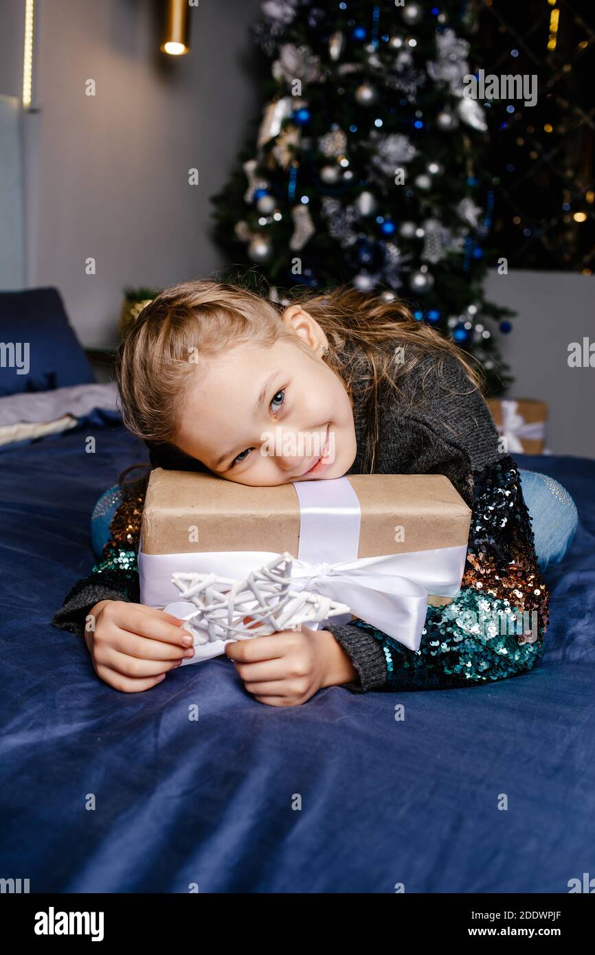 Small cute girl received holiday gift. Enjoy receiving presents. Child ...