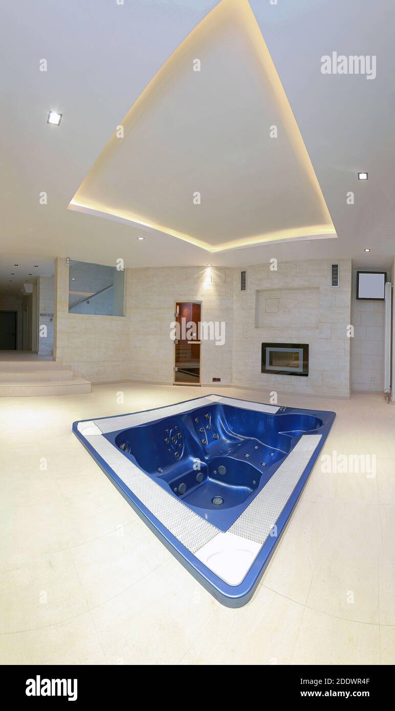 Large empty hot tub inside luxury bathroom interior Stock Photo - Alamy