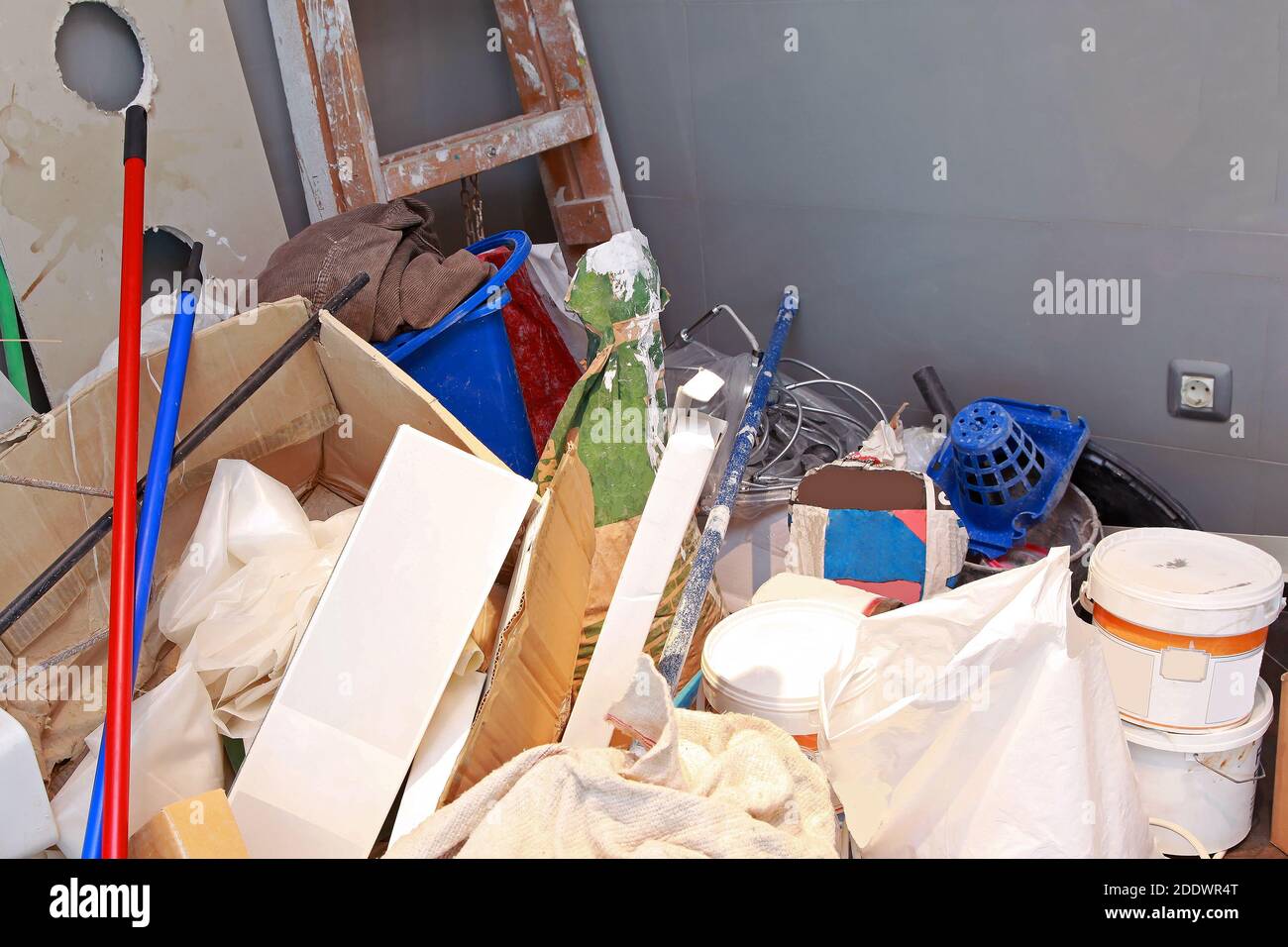 Large dirty messy renovation tools after house interior restoration ...