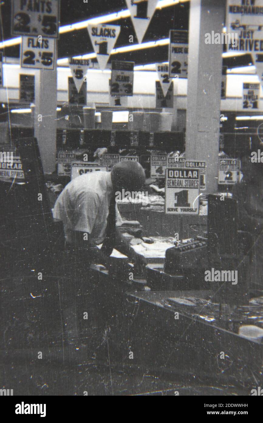 Fine 1970s vintage black and white photography of a regular guy hard at ...