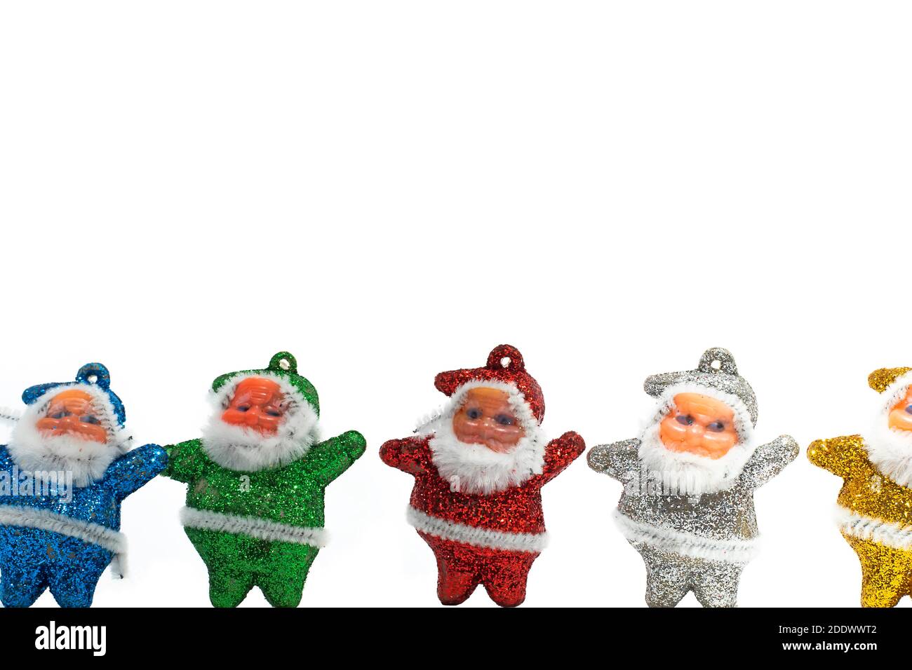 Christmas composition. Multi-colored Santa Claus decorations on white ...