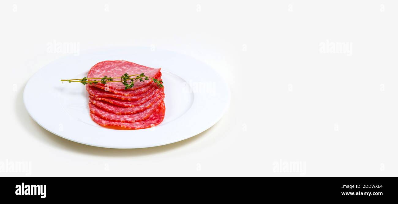 A plate of gourmet salami slices isolated on a white background Stock ...
