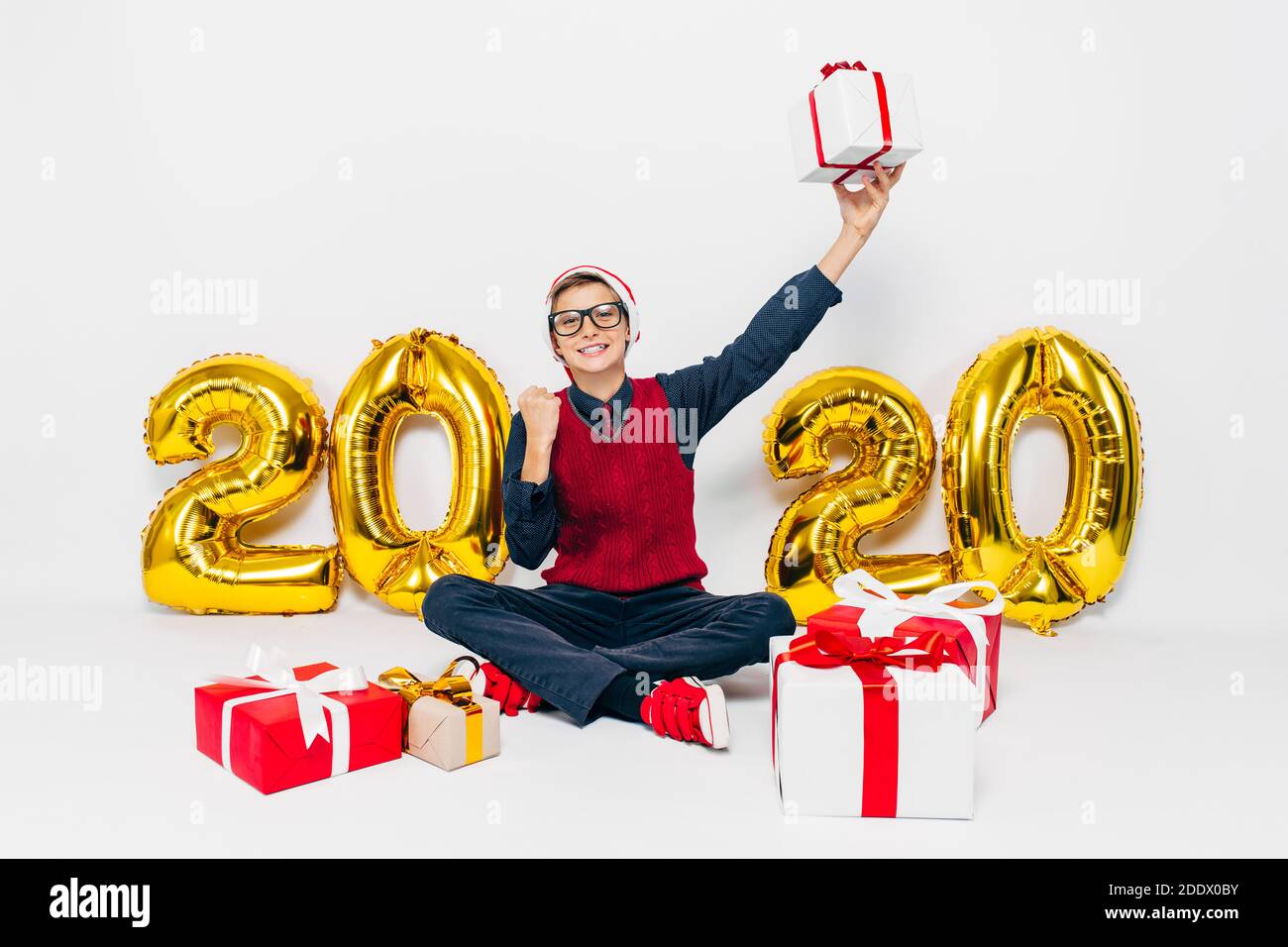 Happy little boy in Santa hat, stylish child delighted with Christmas ...
