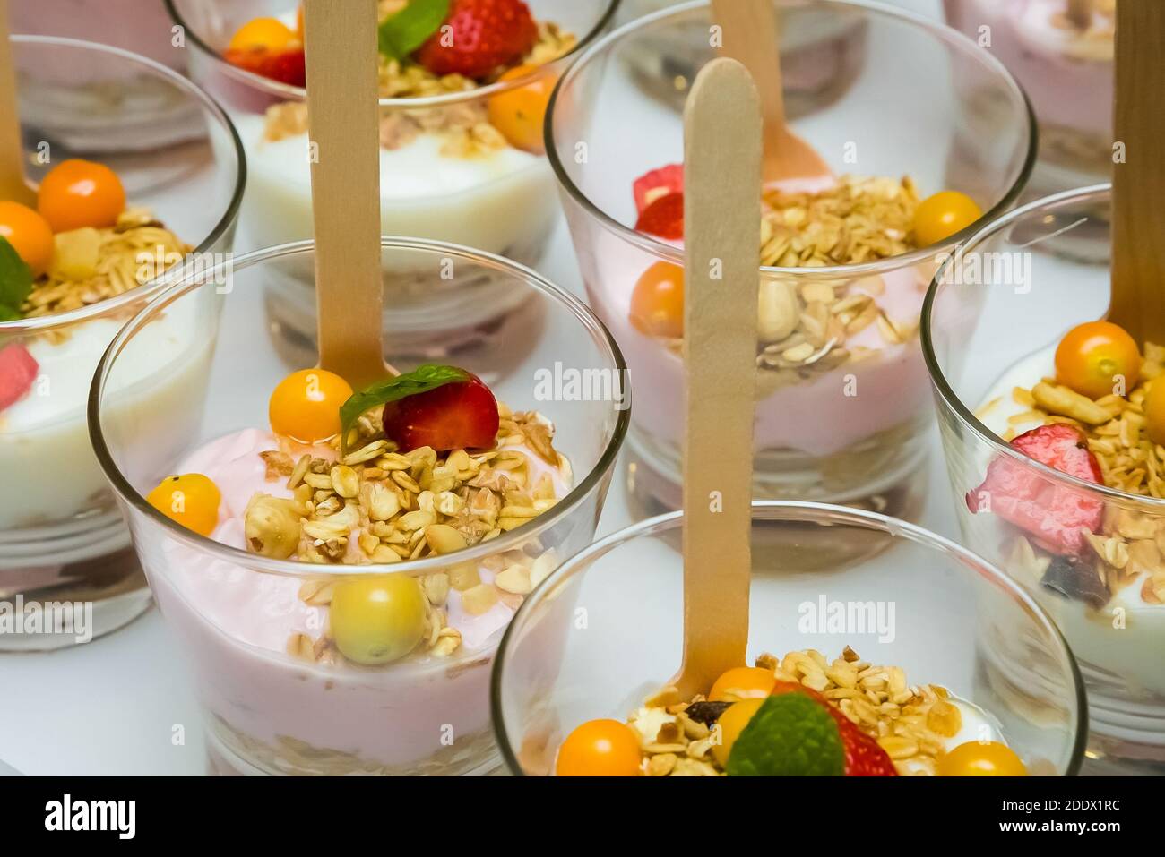 A closeup shot of bowls of yogurt with fruits and oats Stock Photo - Alamy