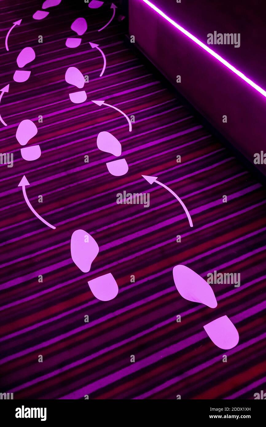 A vertical shot of an illuminated hallway design with footsteps Stock ...