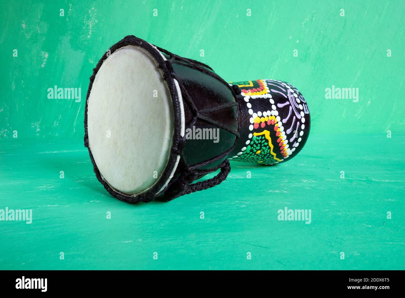 African musical instrument on green background Stock Photo - Alamy