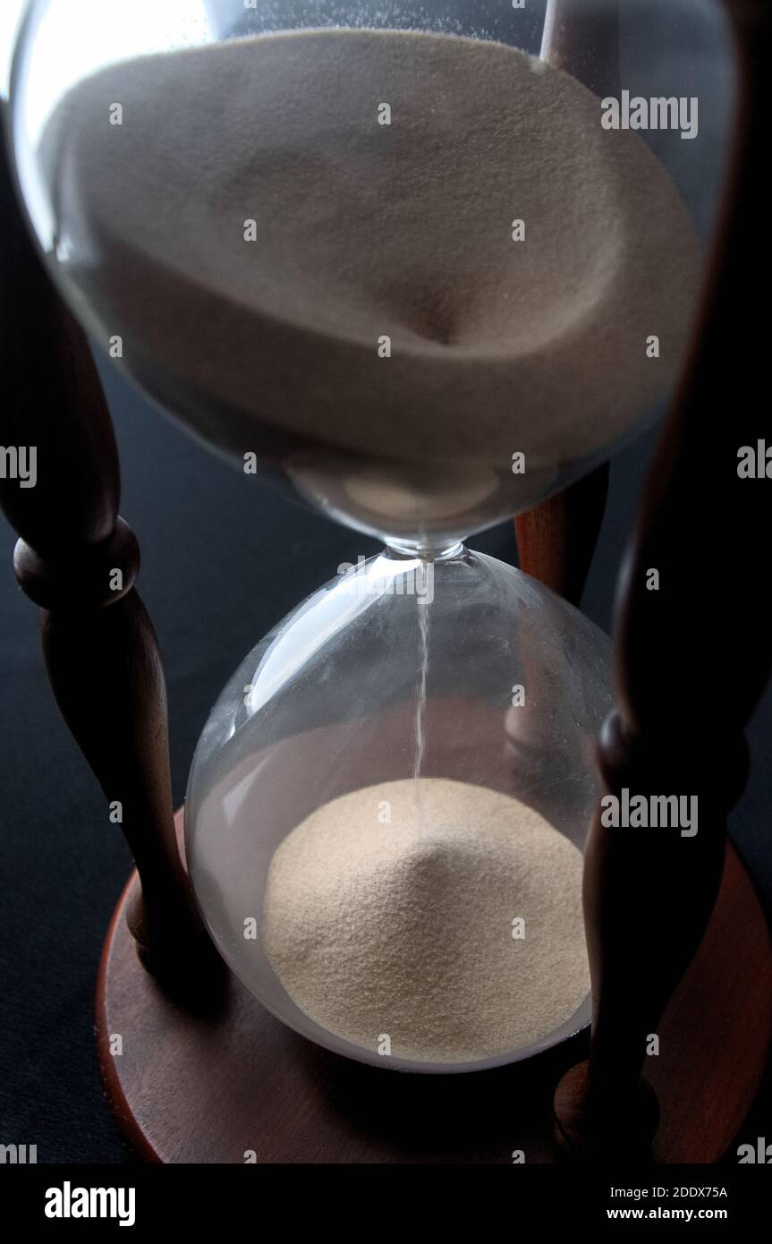 Unique perspective looking down at an hourglass, with natural light ...