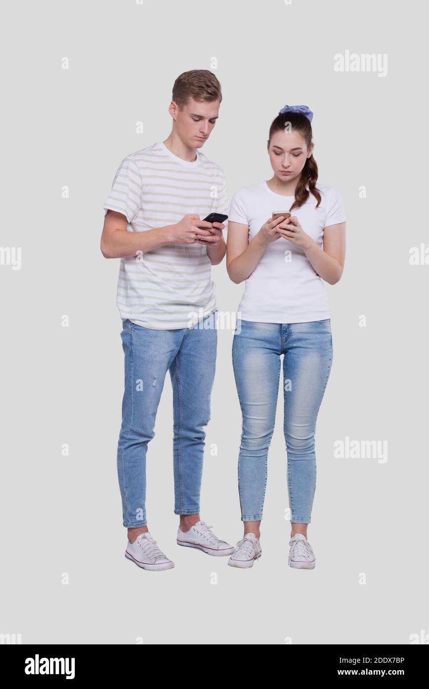 Couple Chatting on Phone. Couple Using Phones Standing Isolated. Couple ...