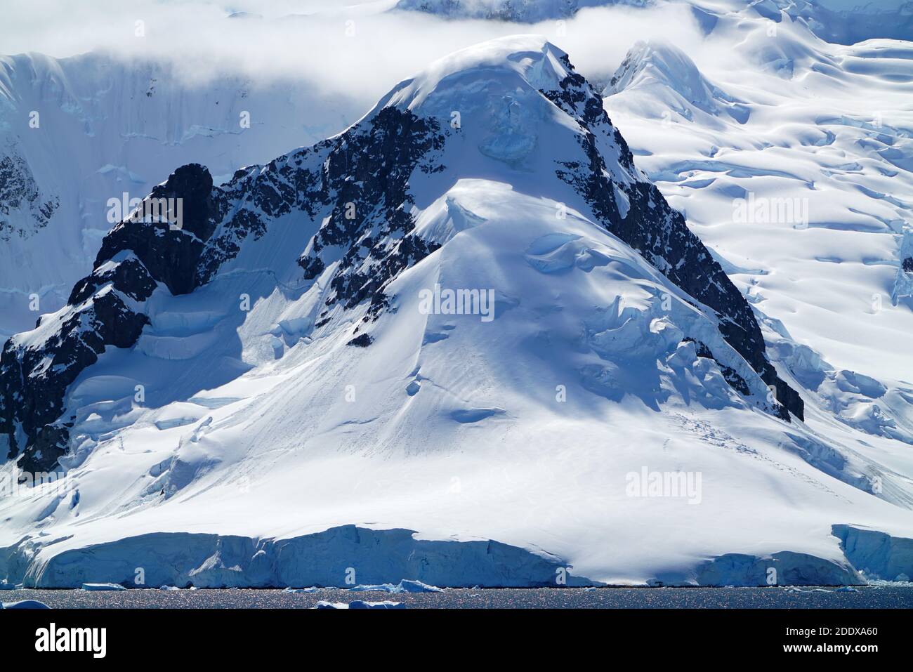 Snow, icebergs, rocks, deep blue sea. A common sight during summer ...