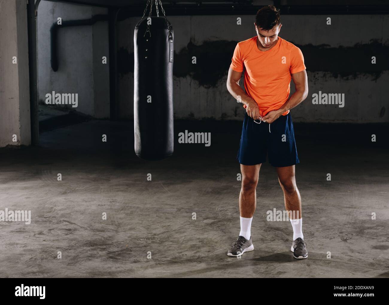 Young boxer prepare to practicing boxing in garage Stock Photo - Alamy