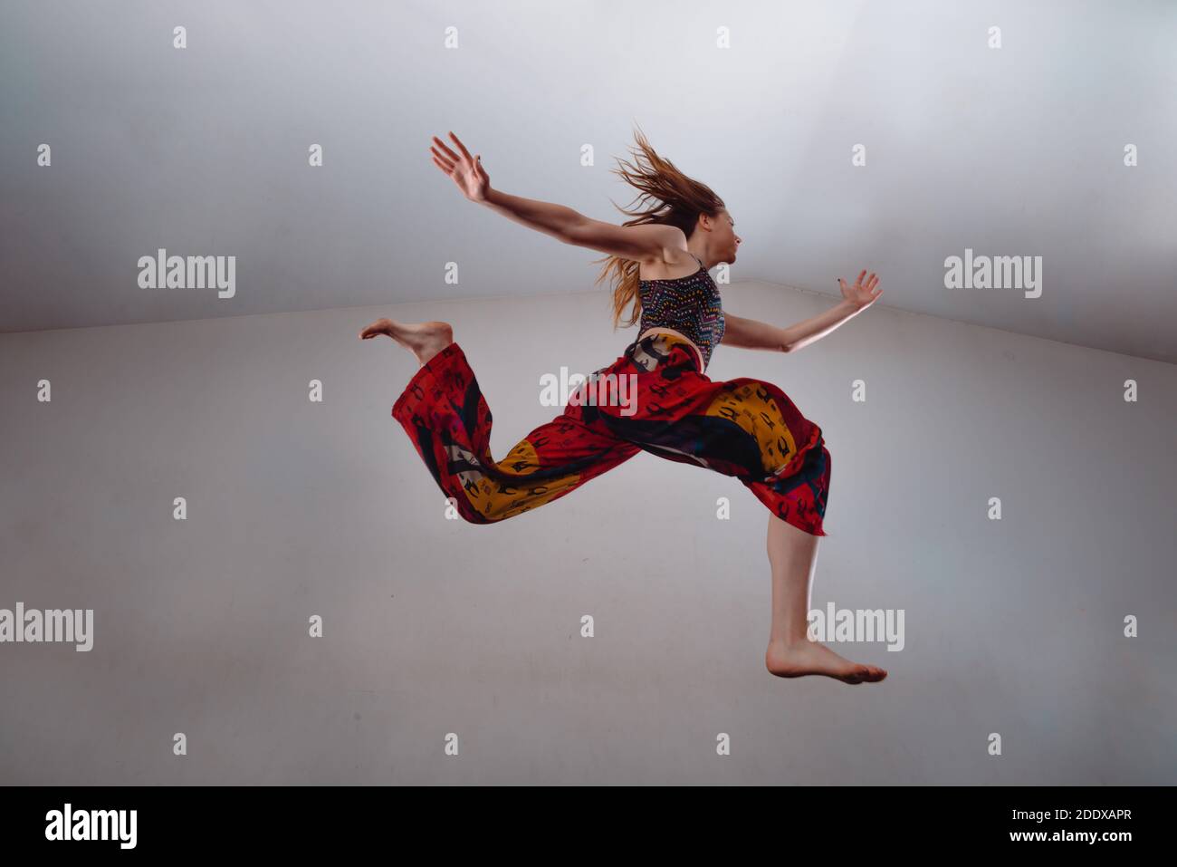 Stylish young woman performing an elegant dance choreography Stock ...