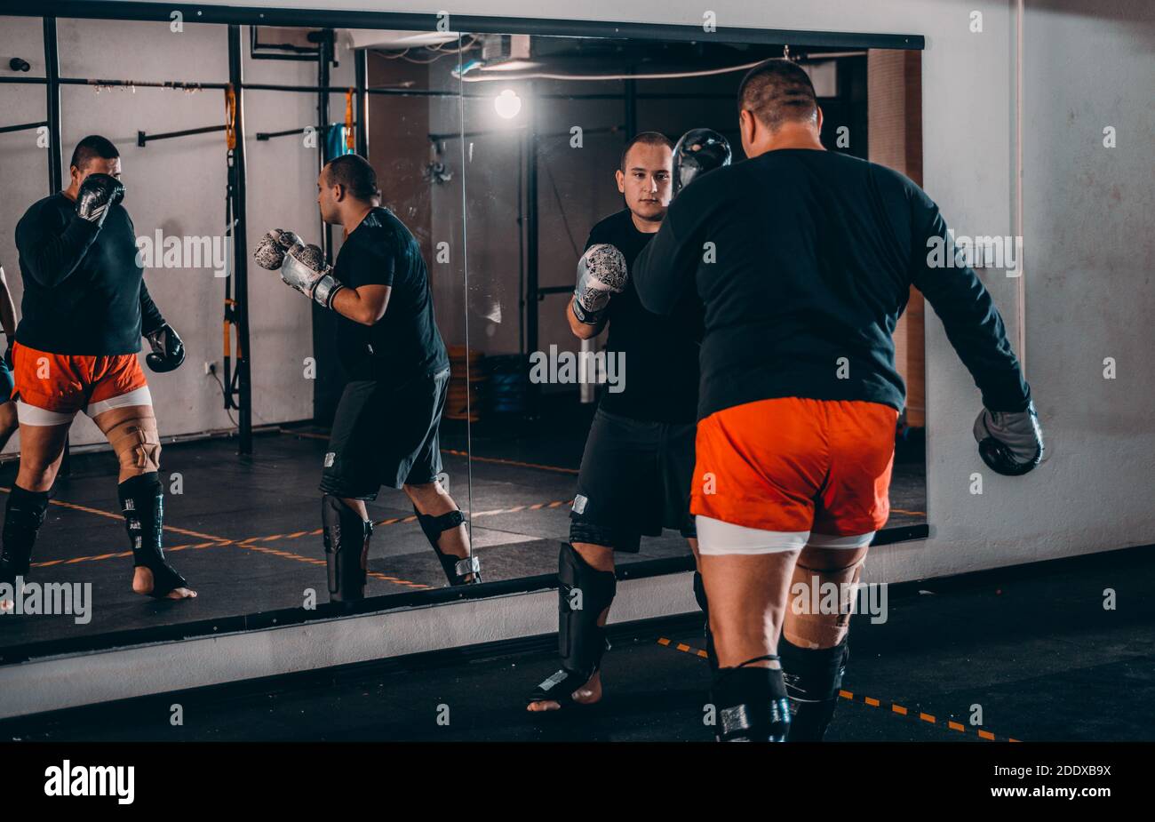 Young boxer prepare to practicing boxing in garage Stock Photo - Alamy