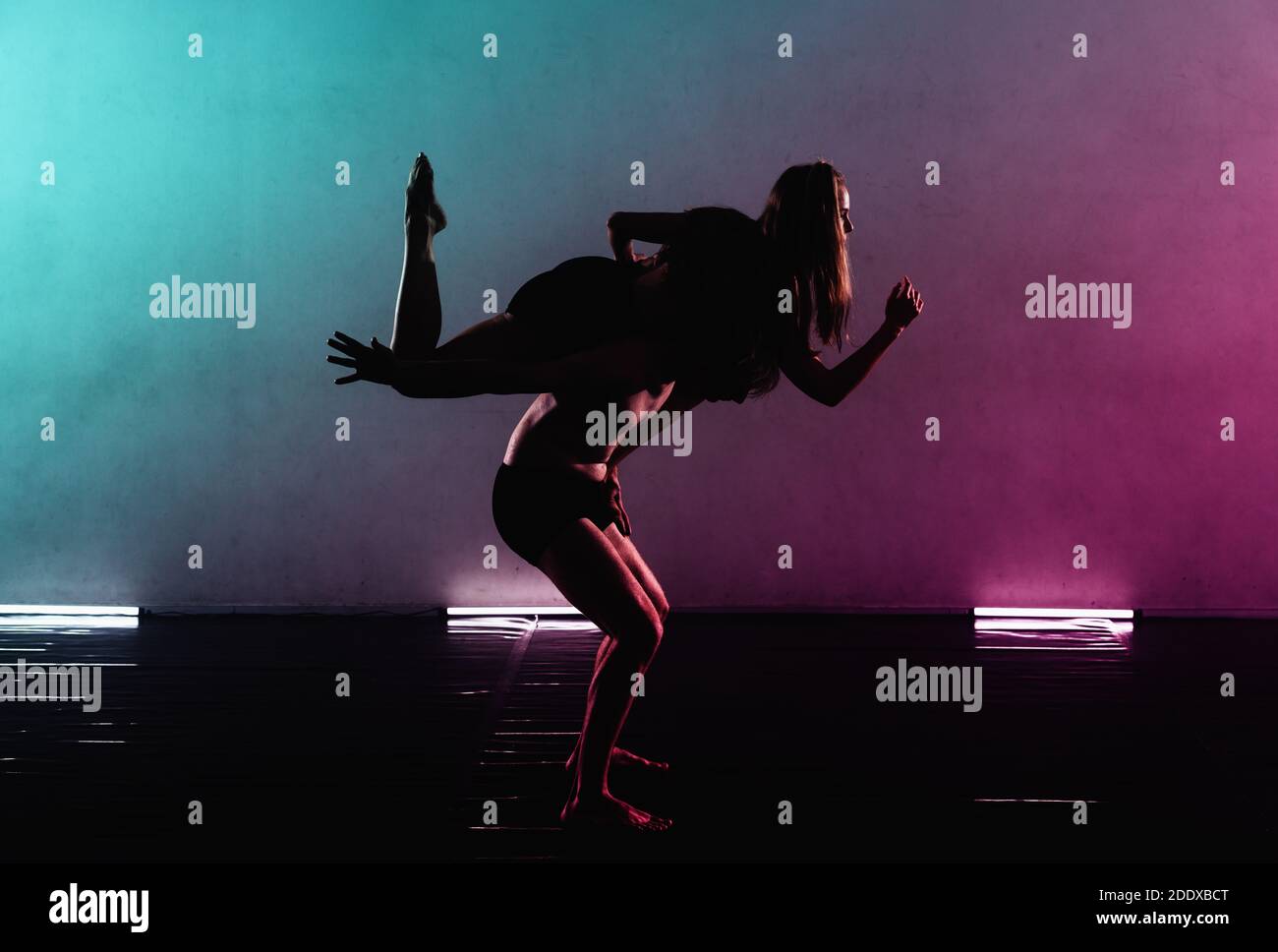 Beautiful slim young dance partners performing elegant ballet ...