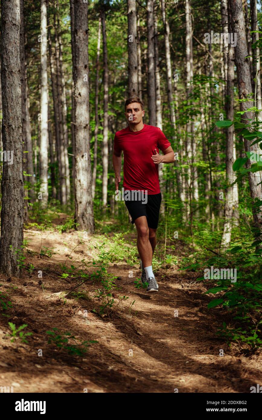 Runner Man running with concentration, determination and strength ...
