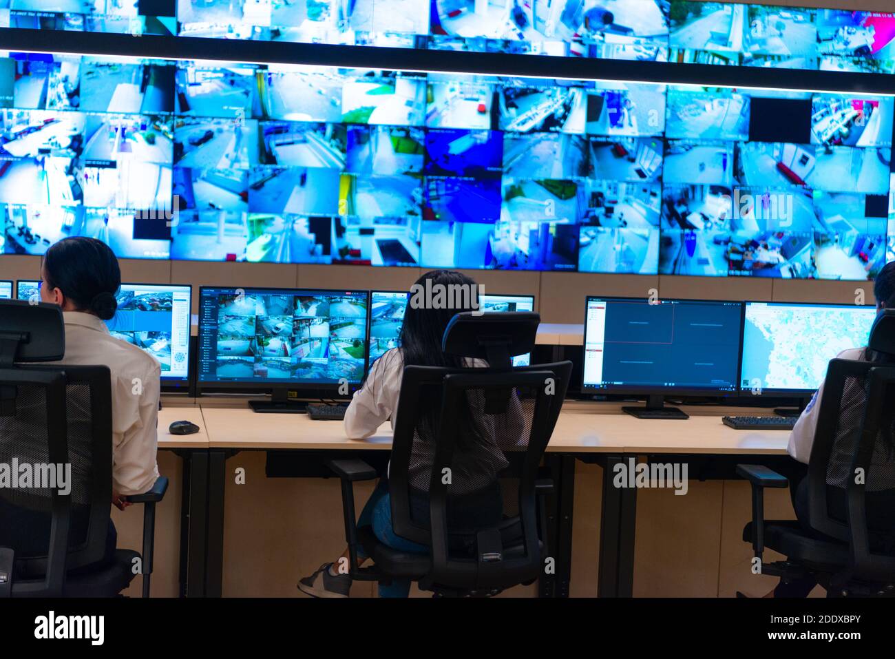 Team of secret agents in uniforms, monitoring cyber, video and ...