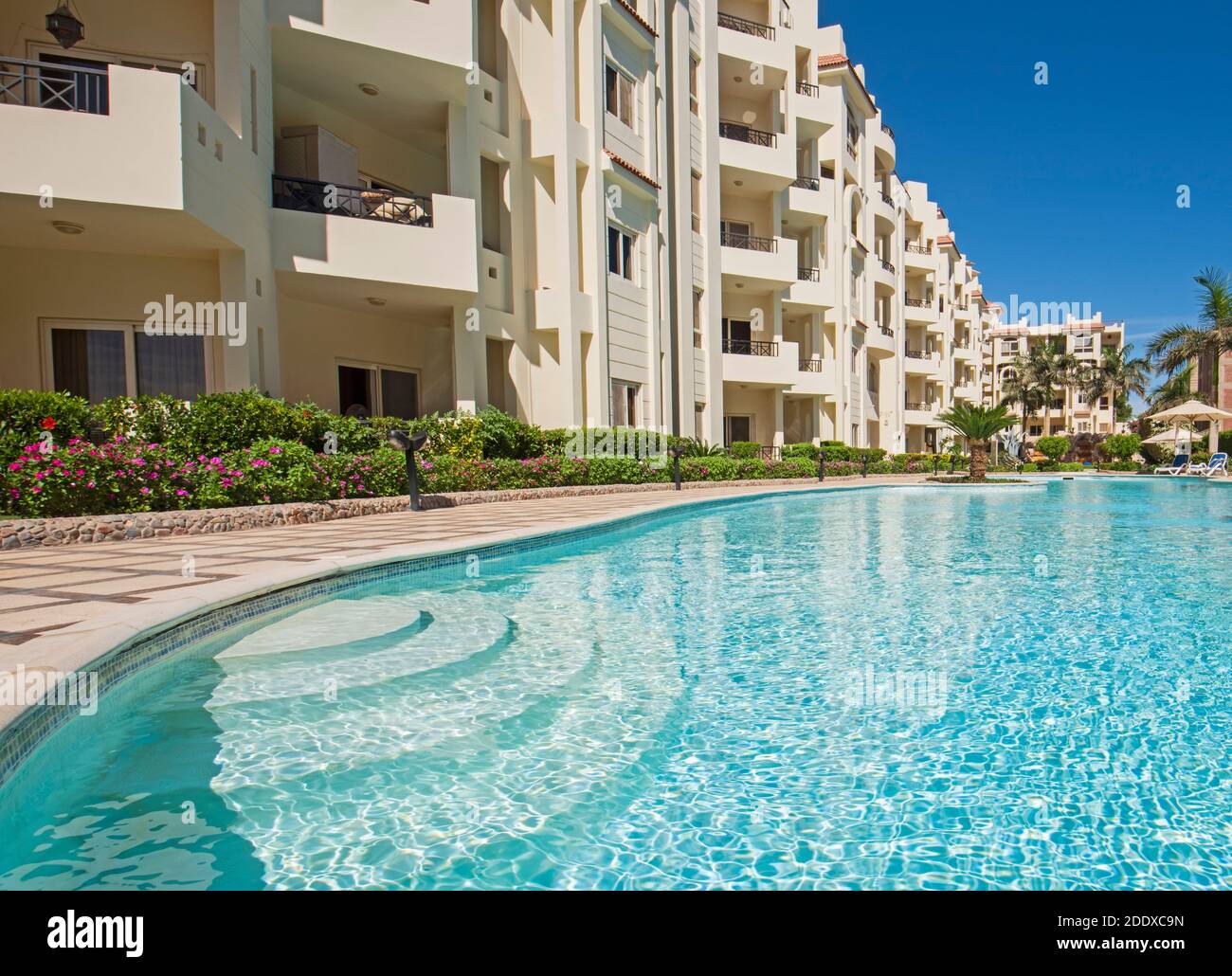 Large swimming pool with steps at a luxury tropical hotel resort Stock ...