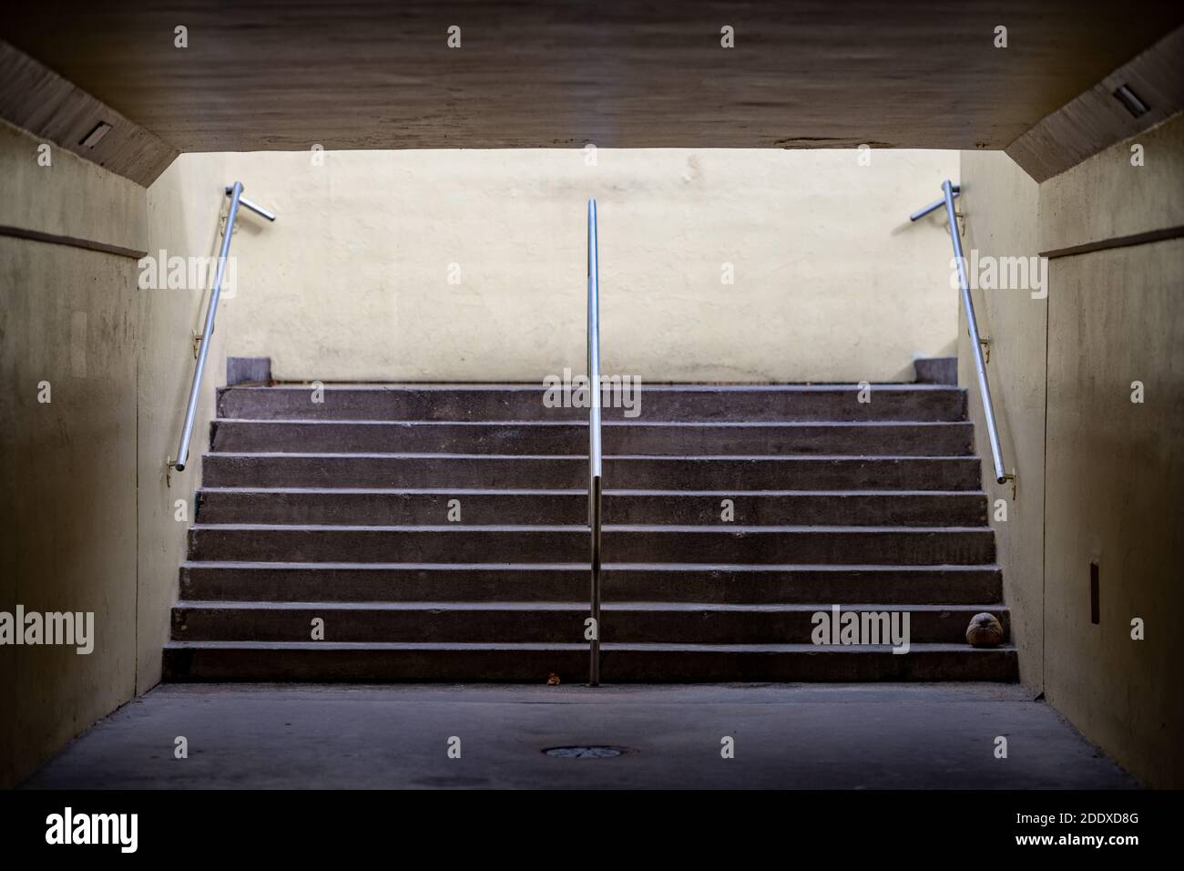 Pedestrian tunnel walkway with stairs light at end Stock Photo - Alamy
