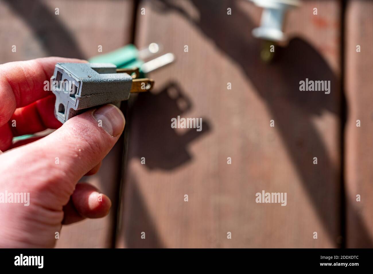 Typical use of a 3-prong electrical power adapter to go from a grounded ...
