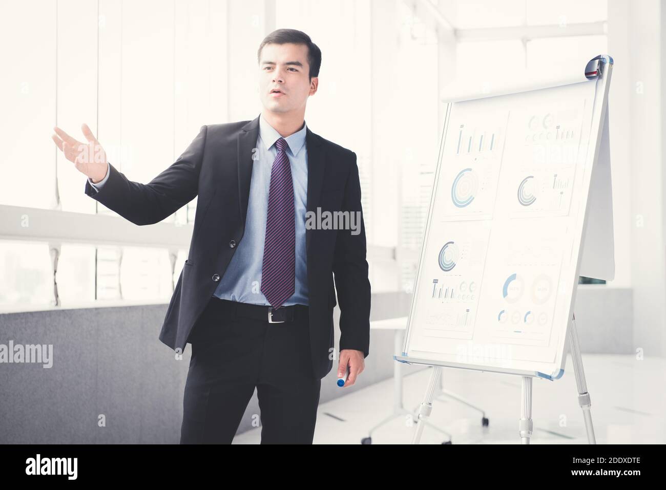 Young businessman as a meeting leader presenting his work Stock Photo ...