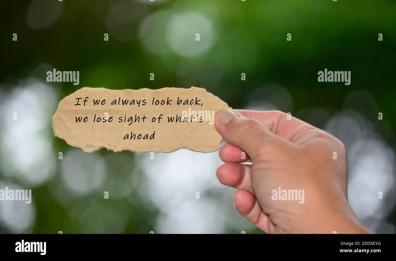 Text Written On Hands Holding Torn Paper With Blurred Dark Background ...