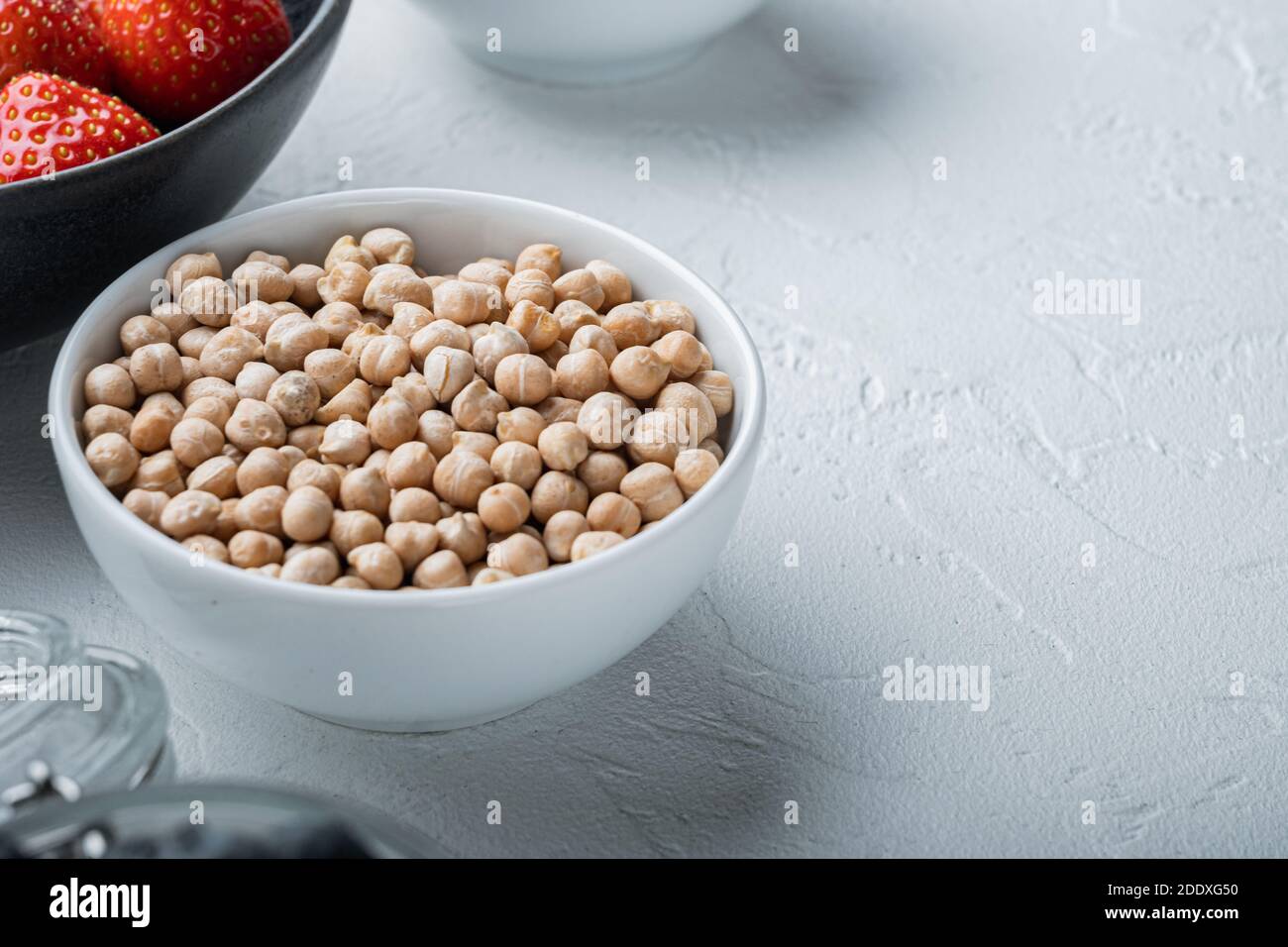 Chickpea in white bowl with space for text, on white background Stock ...