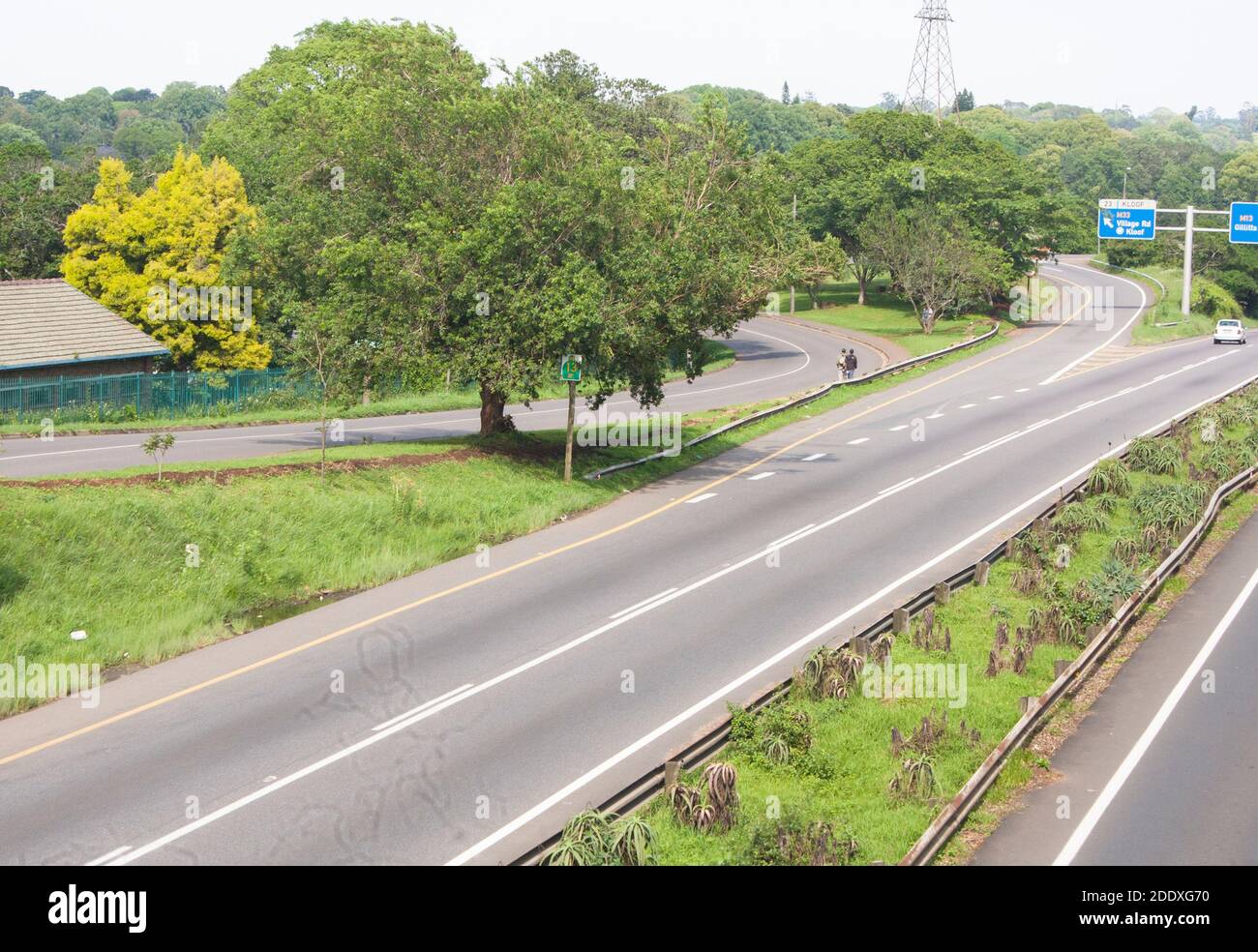 Double lane asphalt highway with sign posted off ramp Stock Photo - Alamy
