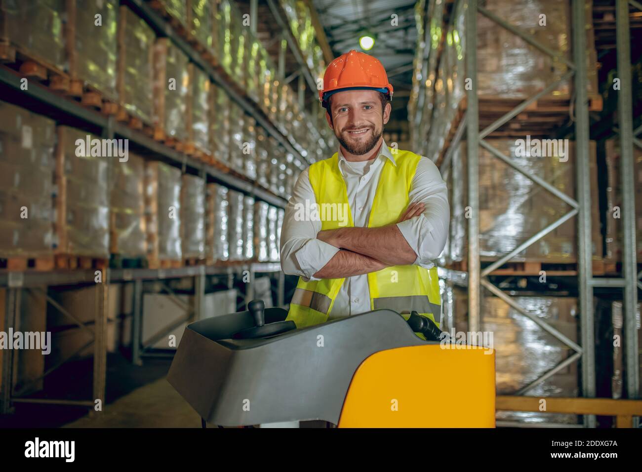 Young warehouse worker in orange hi-res stock photography and images ...