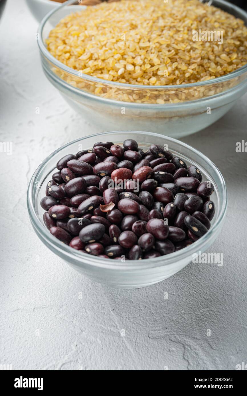 Red beans in bowl with healthy ingredients, on white background Stock ...