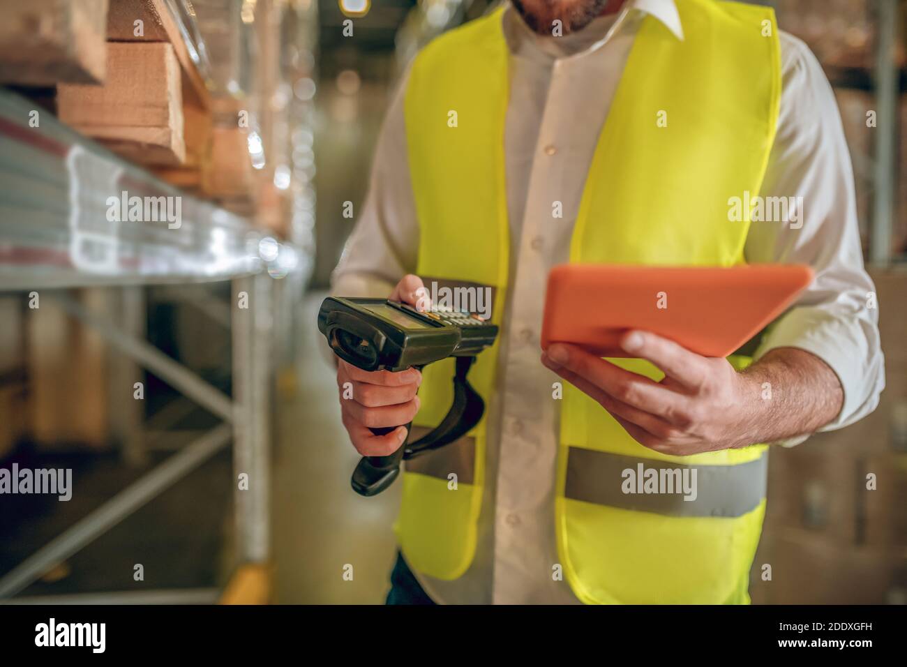 Close up picture of workers hands holding tablet and scanner Stock ...