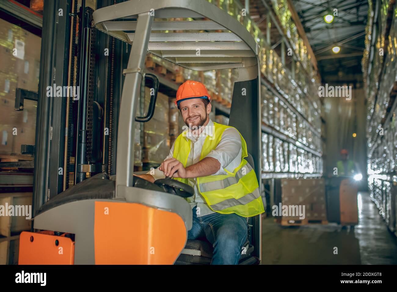 Positive male warehouse worker hi-res stock photography and images - Alamy