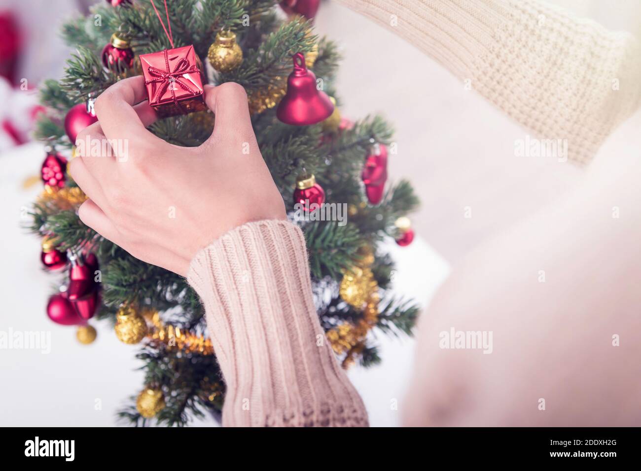Woman red christmas ball hi-res stock photography and images - Alamy