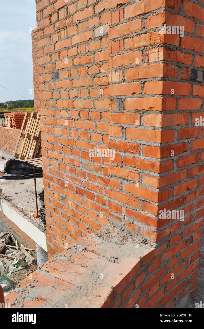 Brick house window hole under construction Stock Photo - Alamy