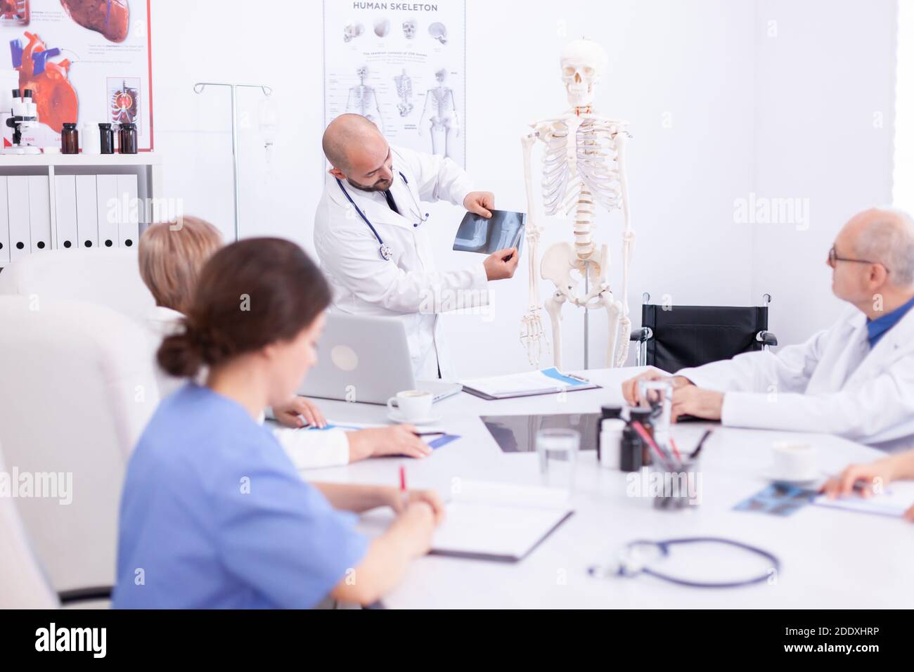 Expert doctor holding radiography during medical seminar for medical ...