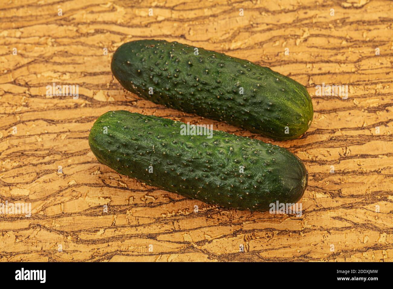 Green fresh two cucumbers over background Stock Photo - Alamy
