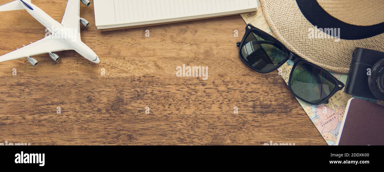 Traveling gadgets including camera, map, passport, sunglasses and ...