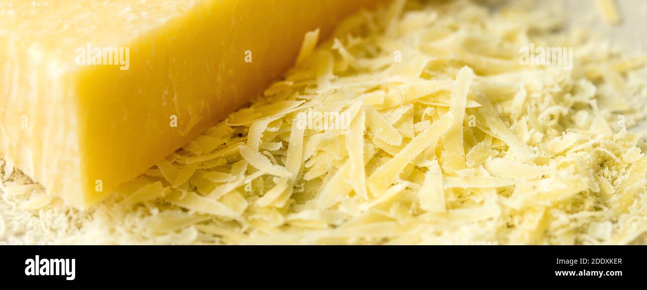Close up of grated Italian parmesan cheese prepared for cooking ...
