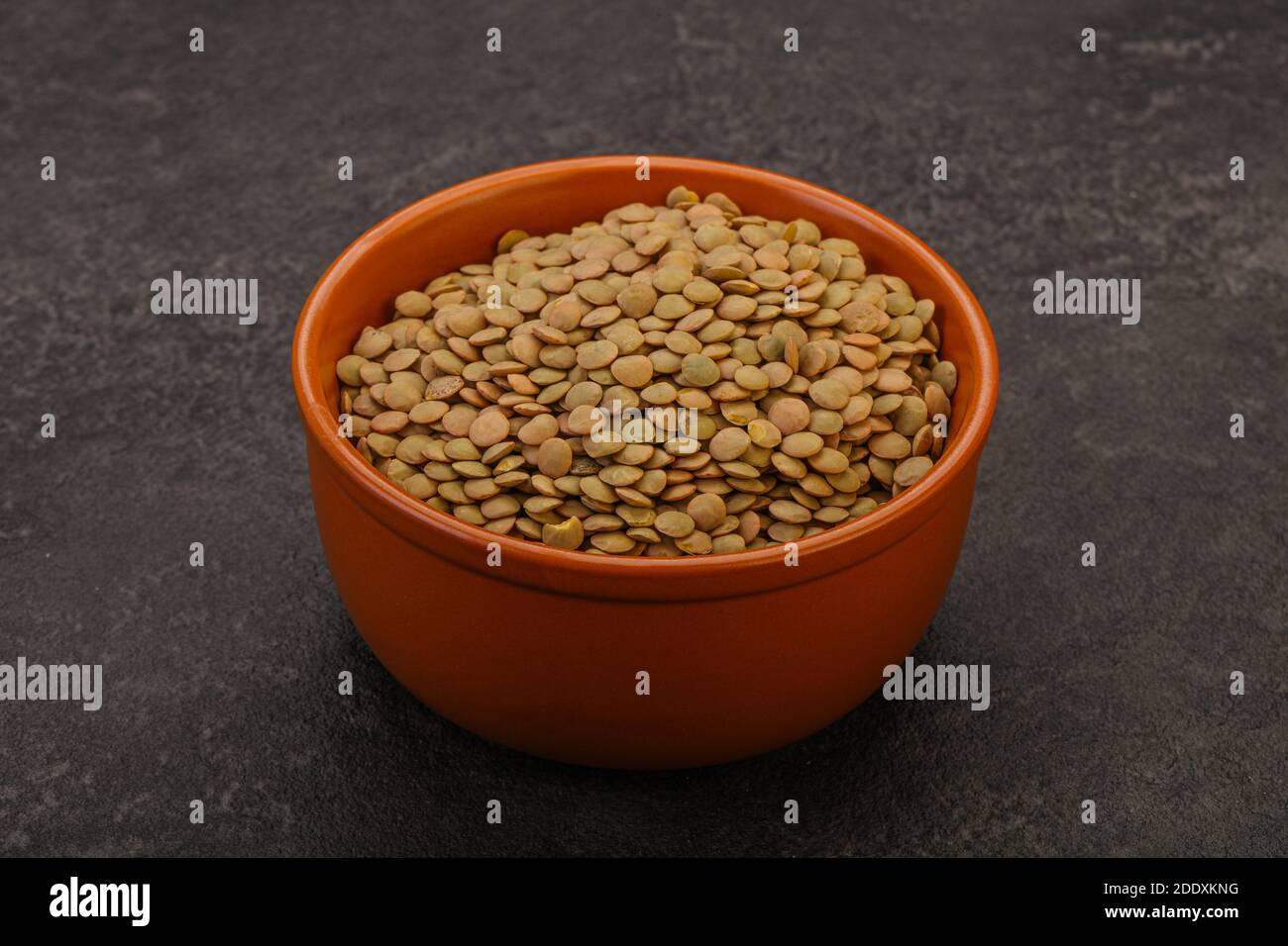 Vegan cuisine - Dry lentil heap isolated Stock Photo - Alamy