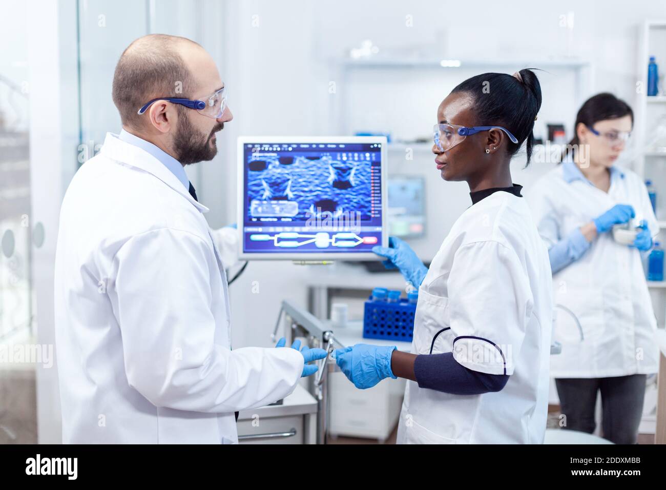 Diverse group working on experiment hi-res stock photography and images - Alamy
