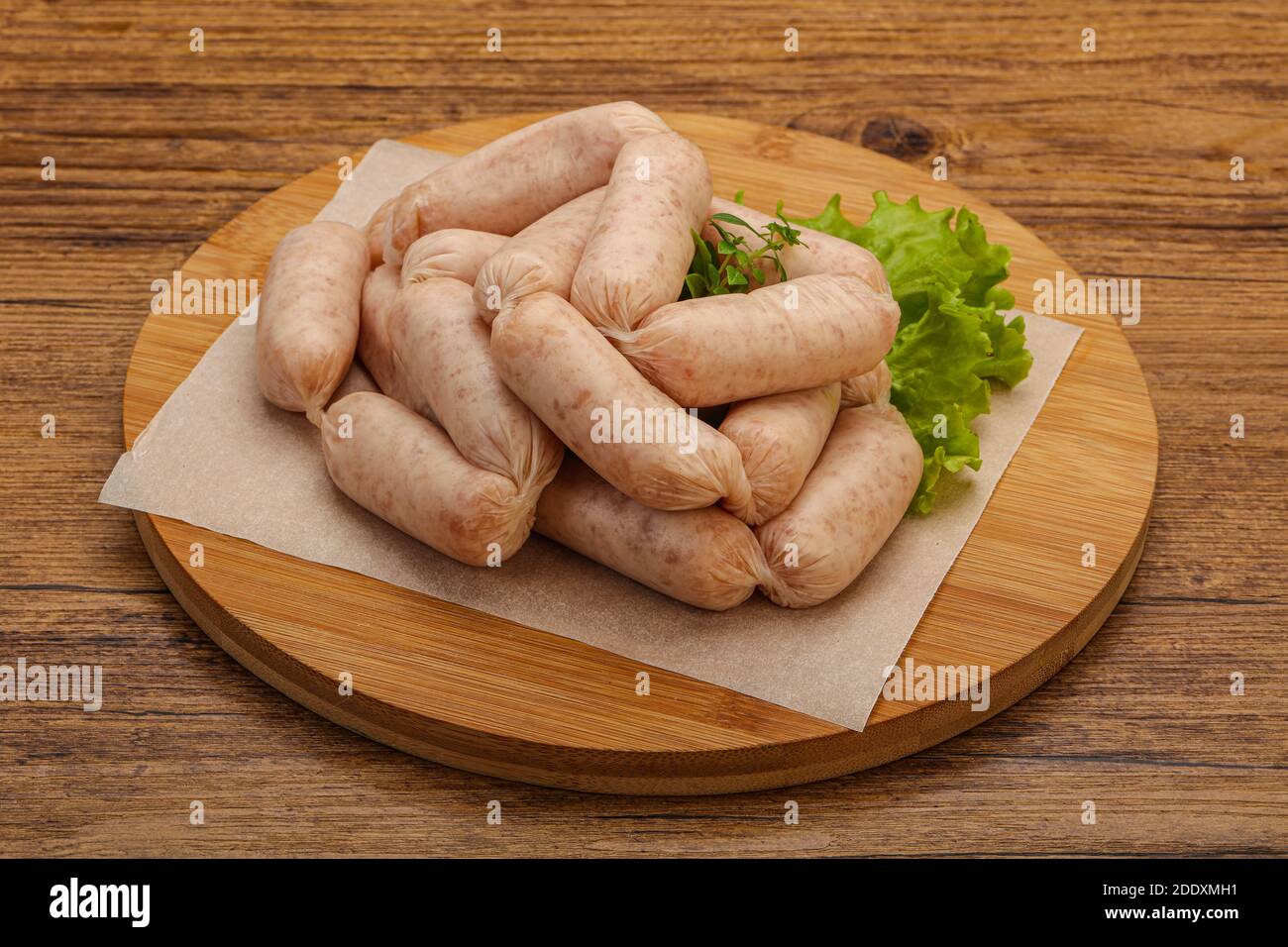 Raw natural chicken baby sausages for roast Stock Photo - Alamy