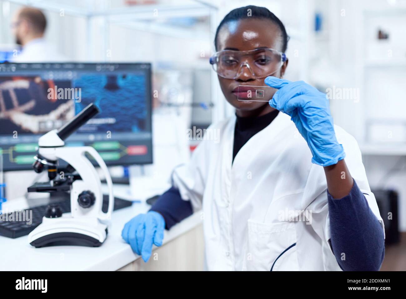 Black doctor microscope hi-res stock photography and images - Alamy