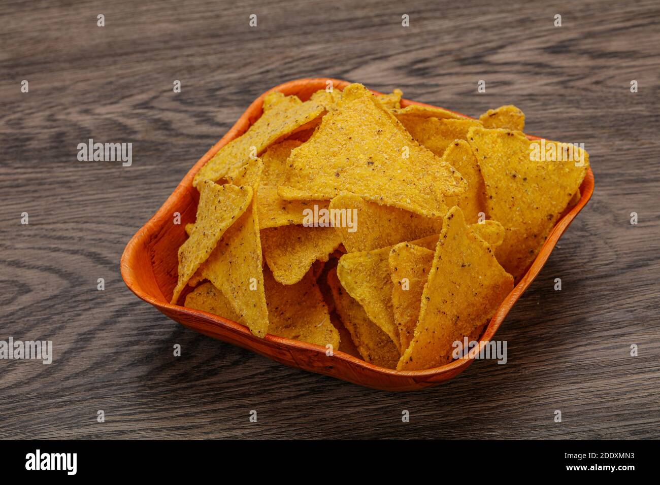 Mexican crunchy corn nachos triangle heap Stock Photo - Alamy